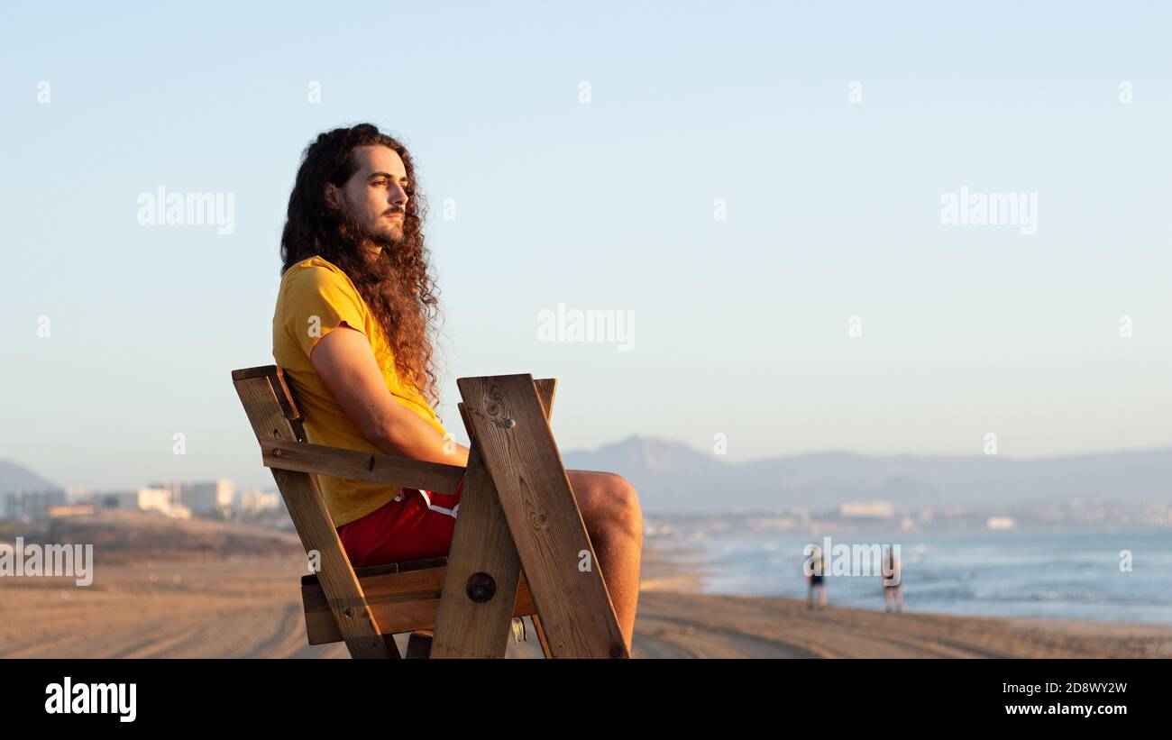 Lifeguard sitting on lifeguard chair hi-res stock photography and ...