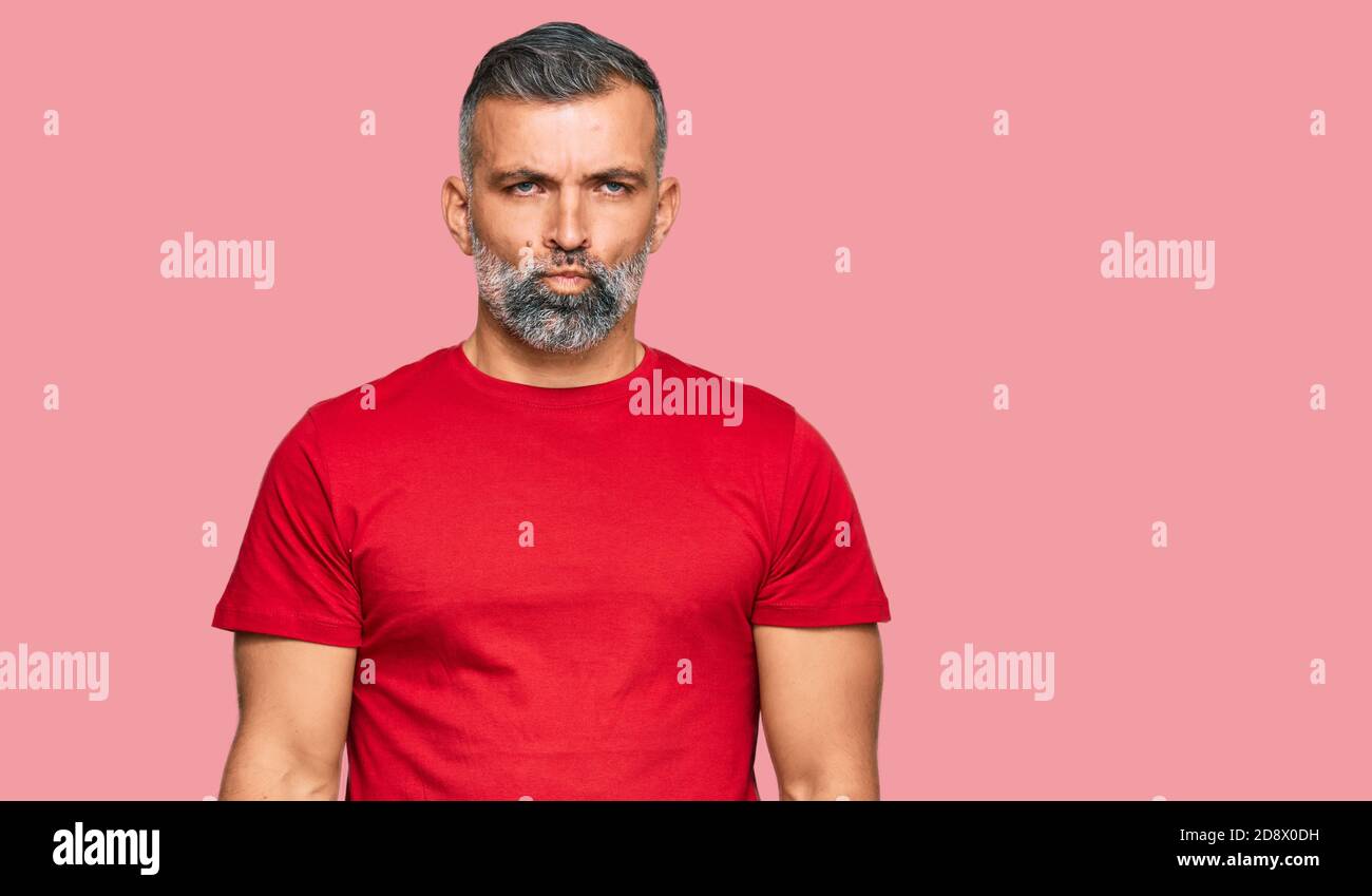 Middle age handsome man wearing casual clothes depressed and worry for ...