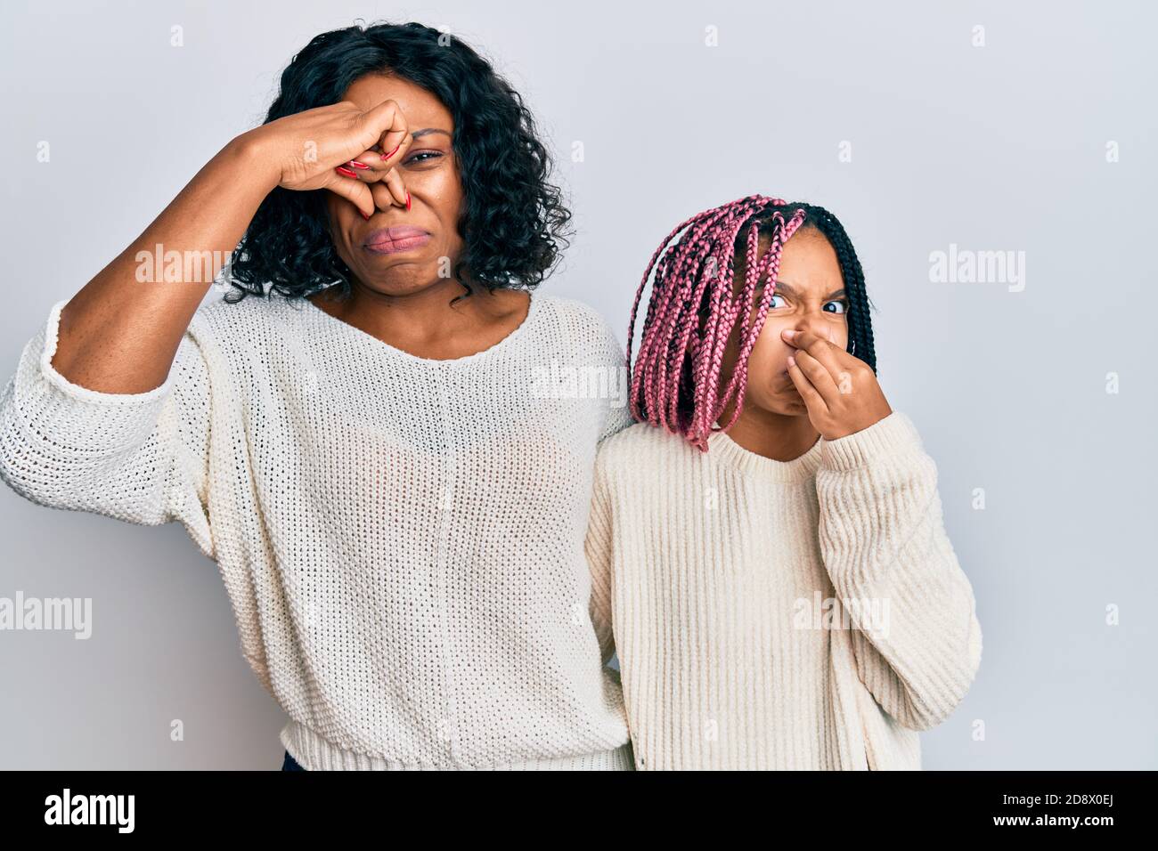 Beautiful african american mother and daughter wearing casual clothes ...