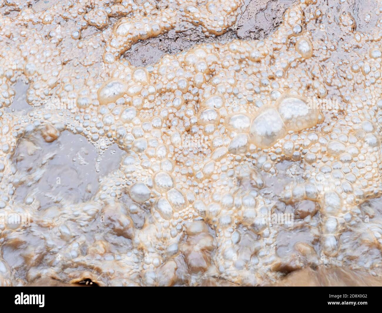 Activated bubbling wastewater on the water surface in detail. City ...