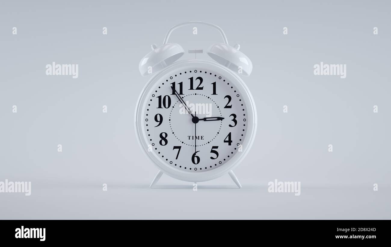 Close-up of an analog alarm clock on white background. (White Stock ...
