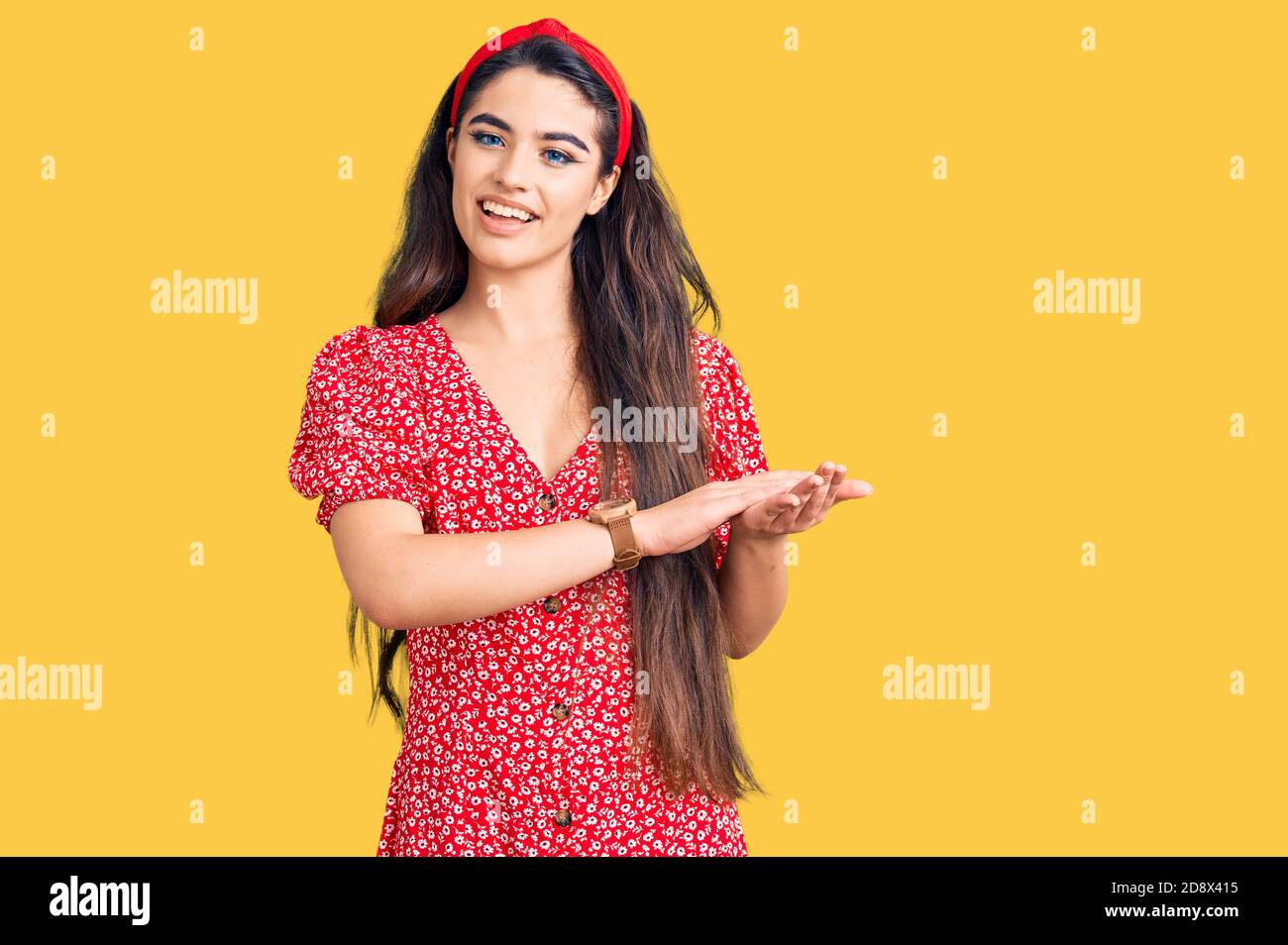 Brunette teenager girl wearing summer dress clapping and applauding ...