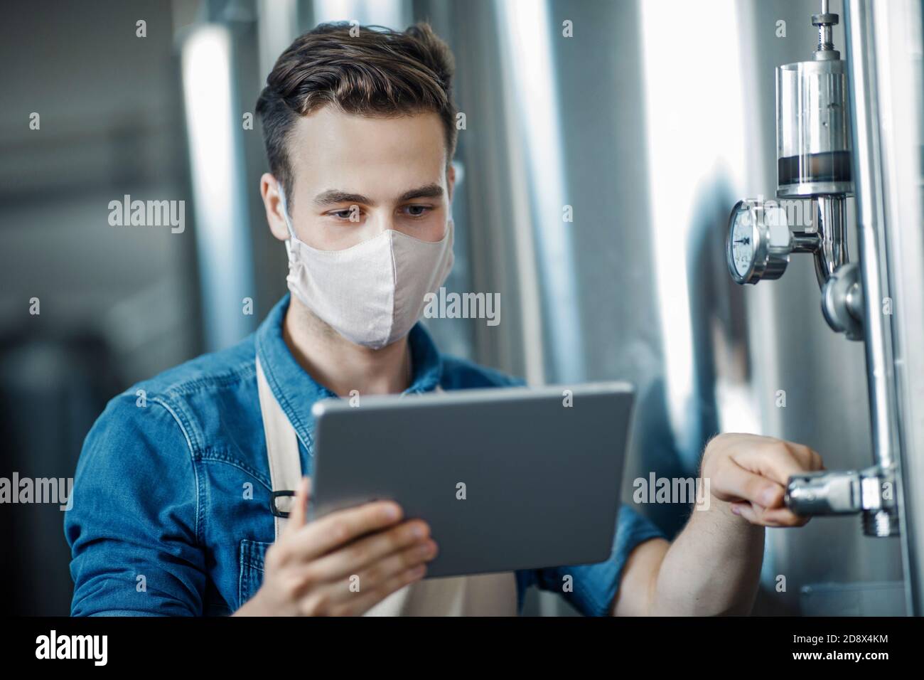 Work with production equipment in modern factory Stock Photo - Alamy