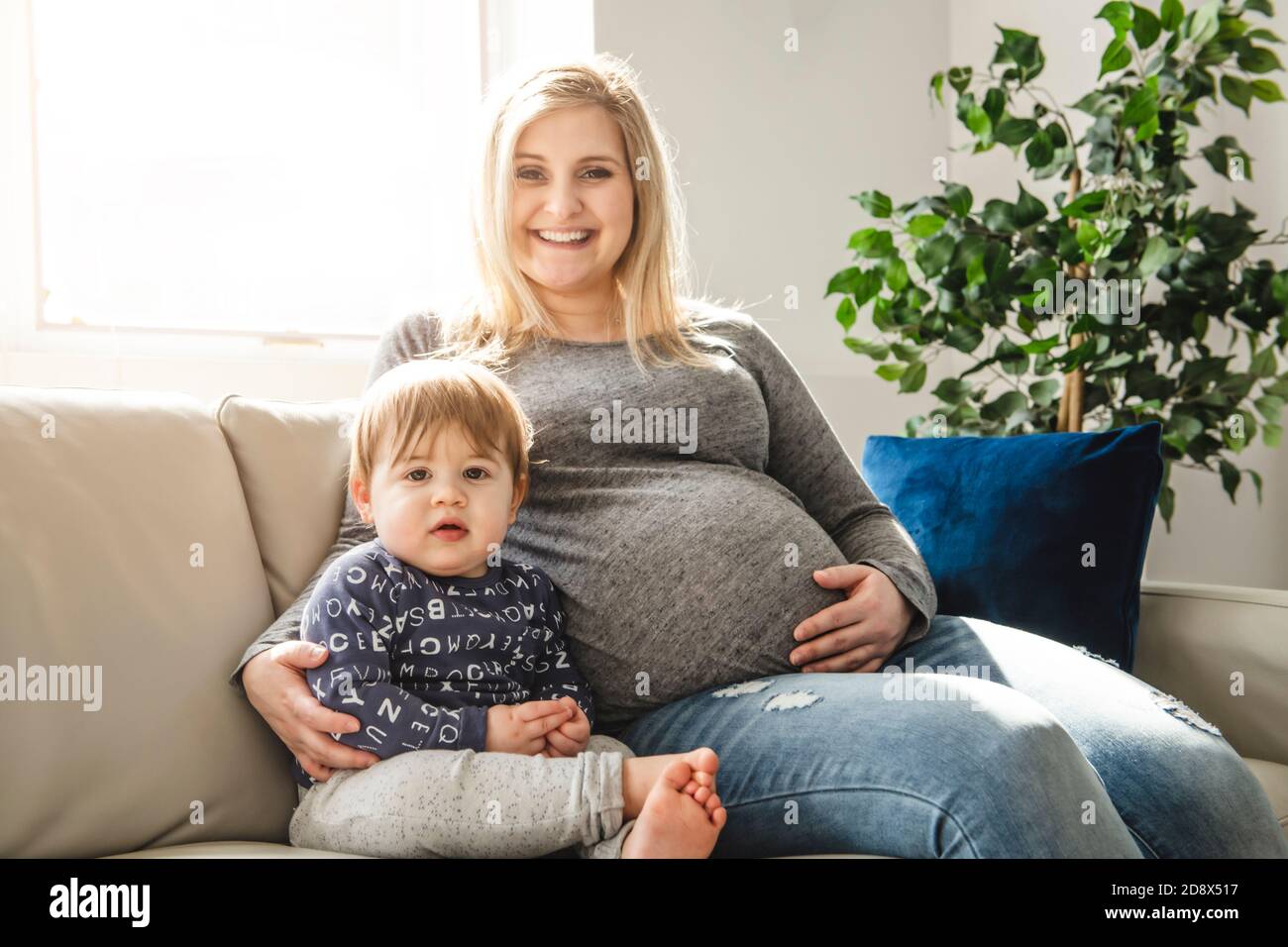 A happy pregnant mother and little son at home Stock Photo - Alamy