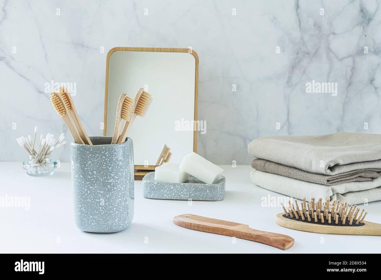 Zero waste concept. Set of eco friendly bathroom accessories - bamboo toothbrushes, cotton buds ...