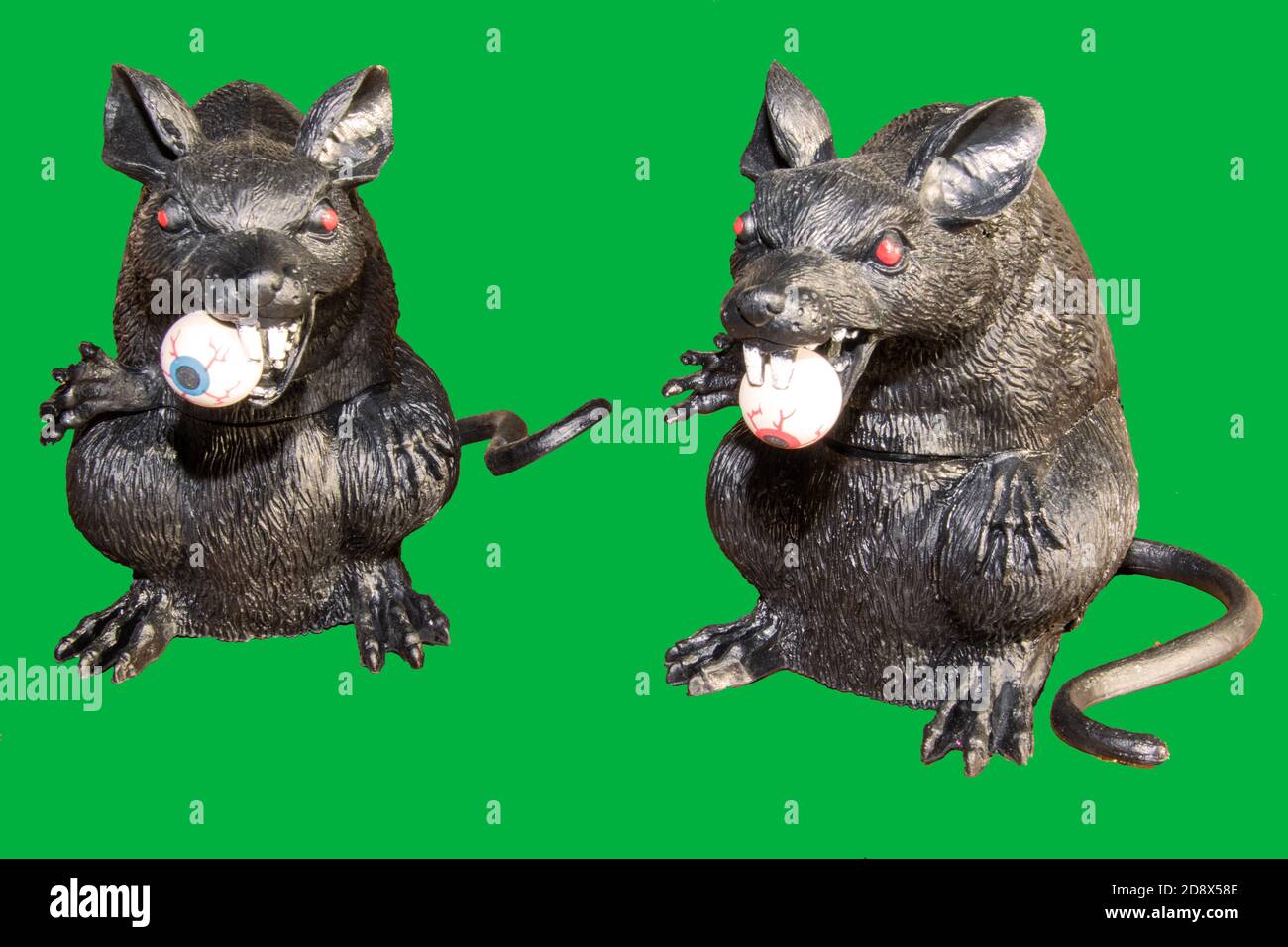 Two fake rats on a green screen background with eyeballs in there ...
