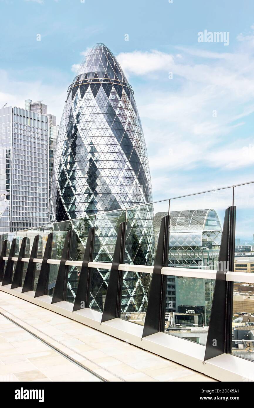 Exterior of The Gherkin, 30 St Mary Axe building with blue sky in ...