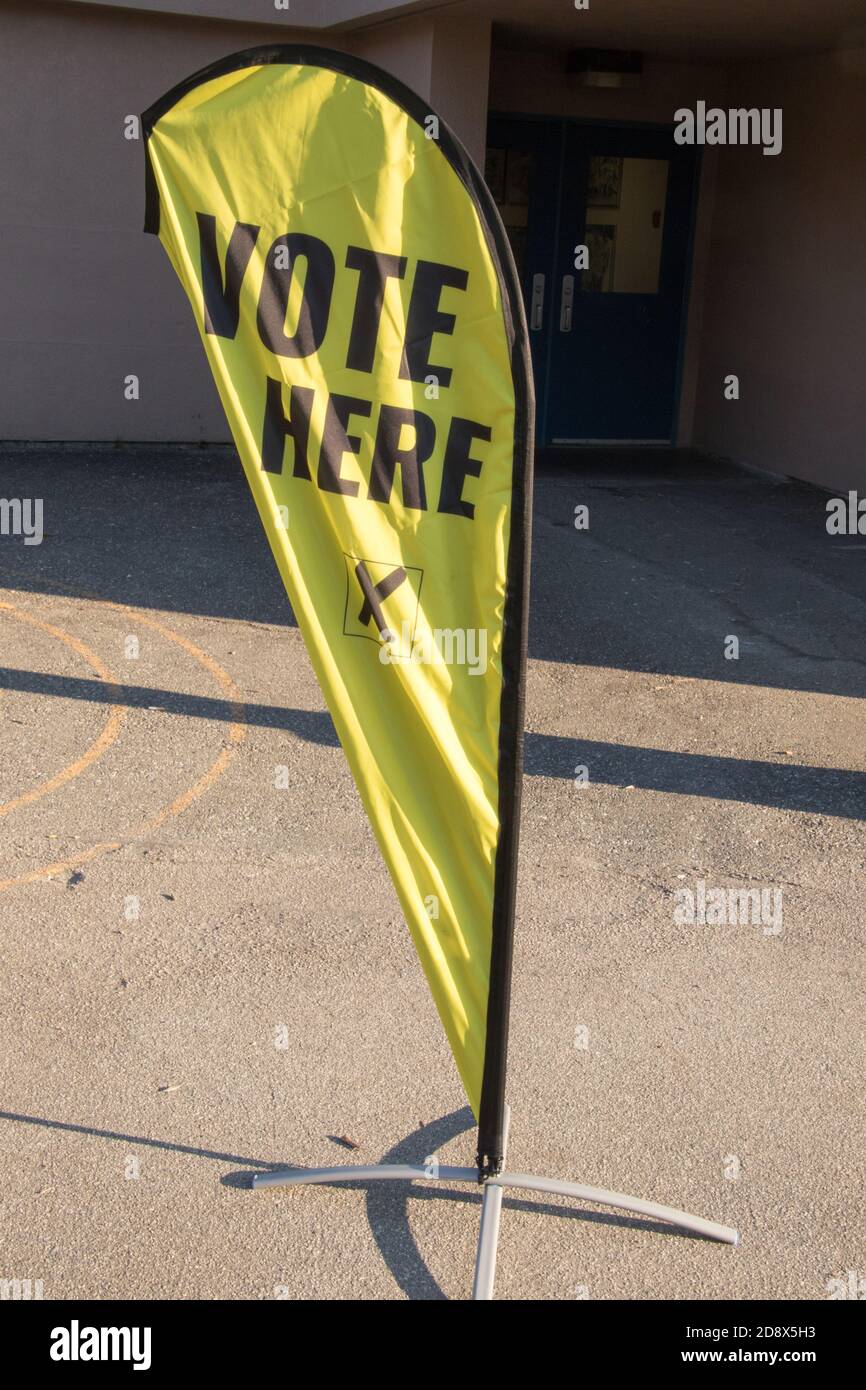 A sign/banner outside a building indicating that a polling station is ...