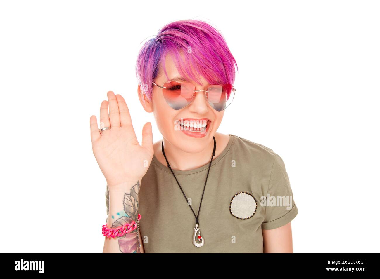 Young woman happy smiling greeting someone saying showing hi waving ...