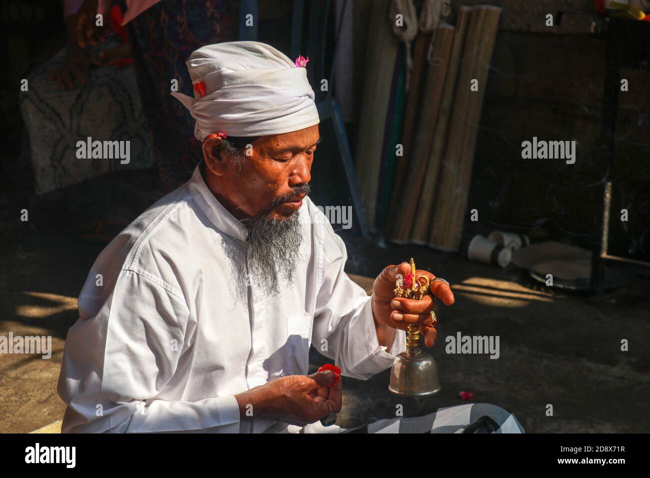Traditional Balinese blessing ceremony by wedding, Priest conduct the ...