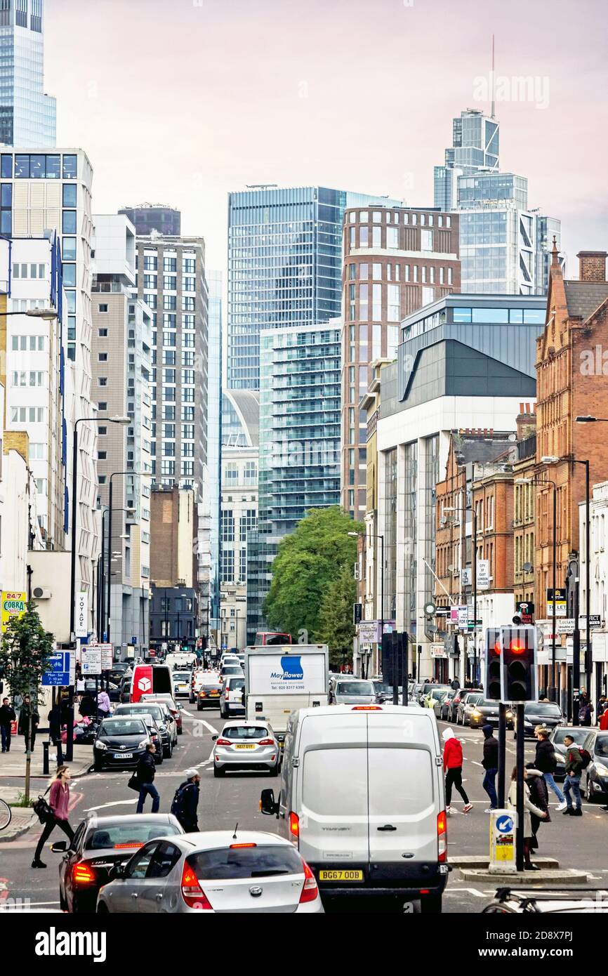 Street view of modern buildings with busy traffic at city of London ...