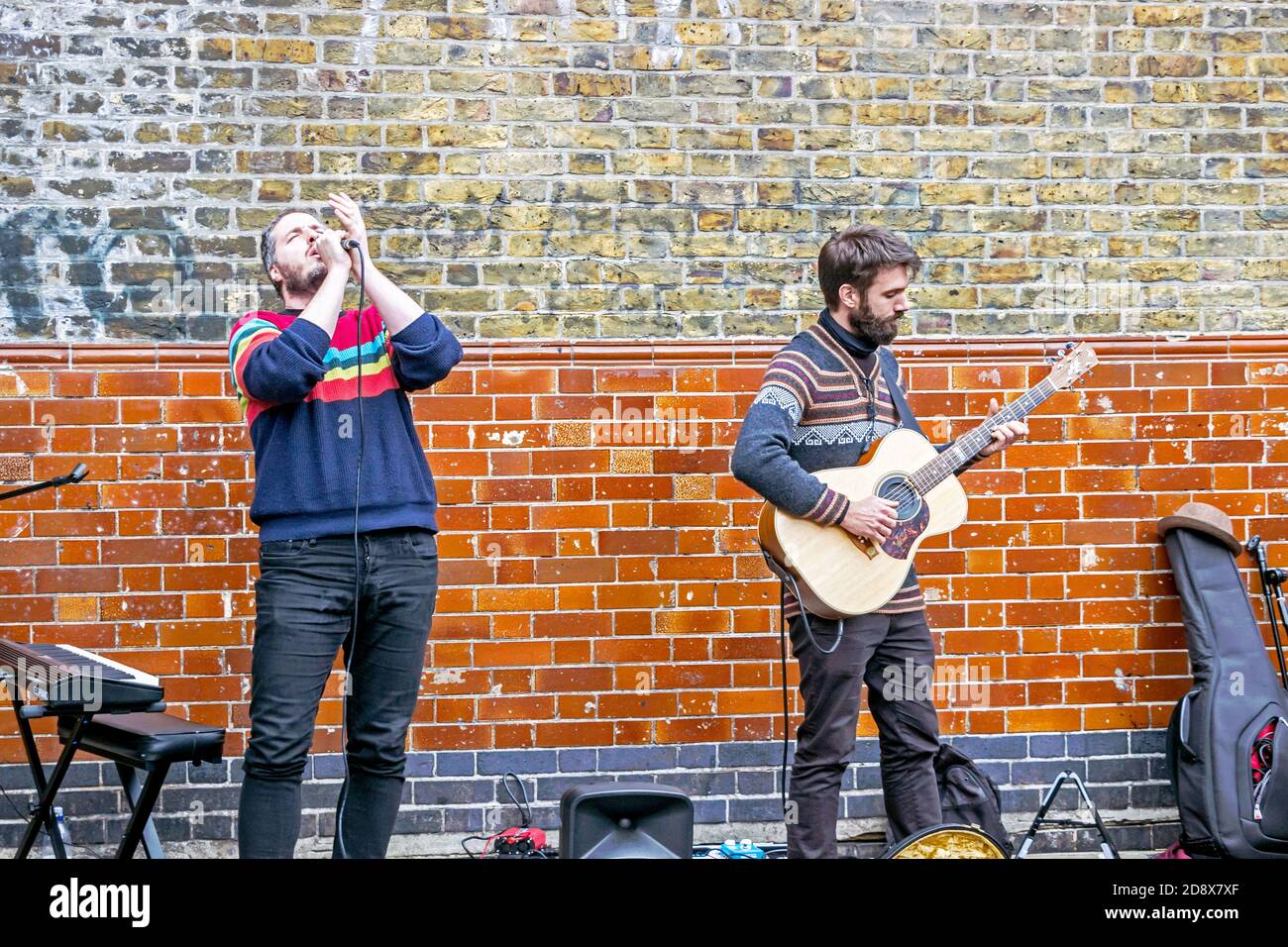 Street artist performance with guitar at Columbia Road Flower Market in ...