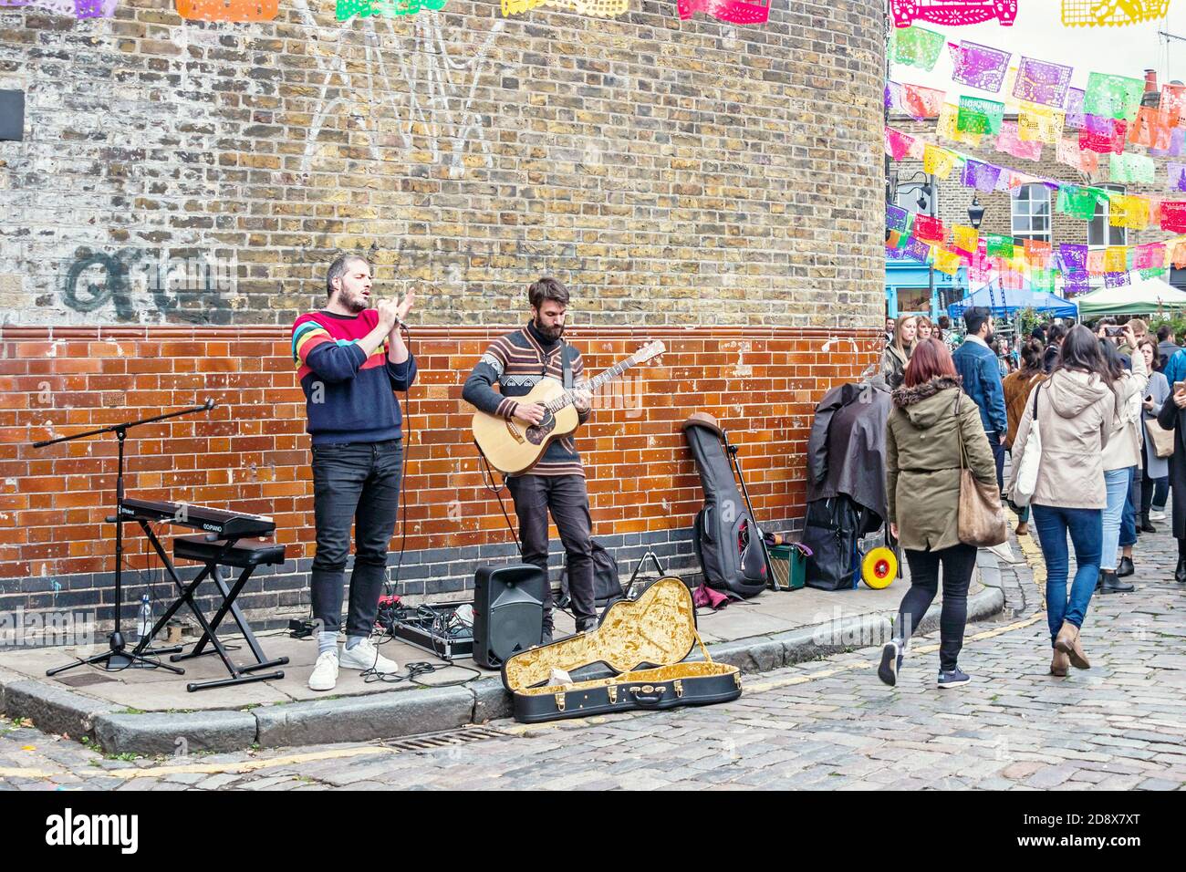 Street artist performance with guitar at Columbia Road Flower Market in ...