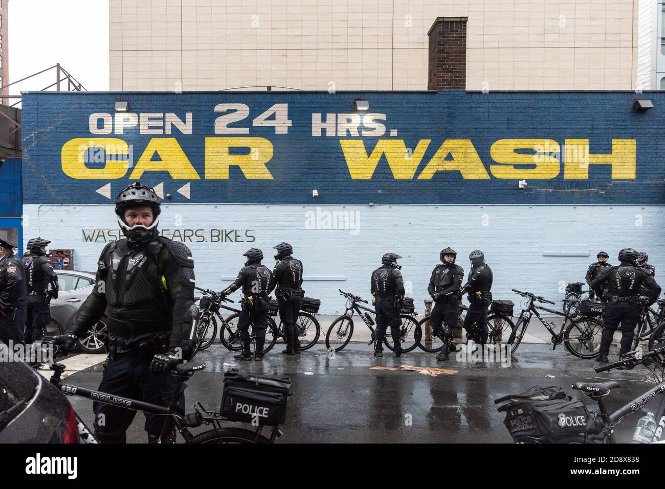 Officers of the NYPD bike unit wait for orders during an anti-Trump ...