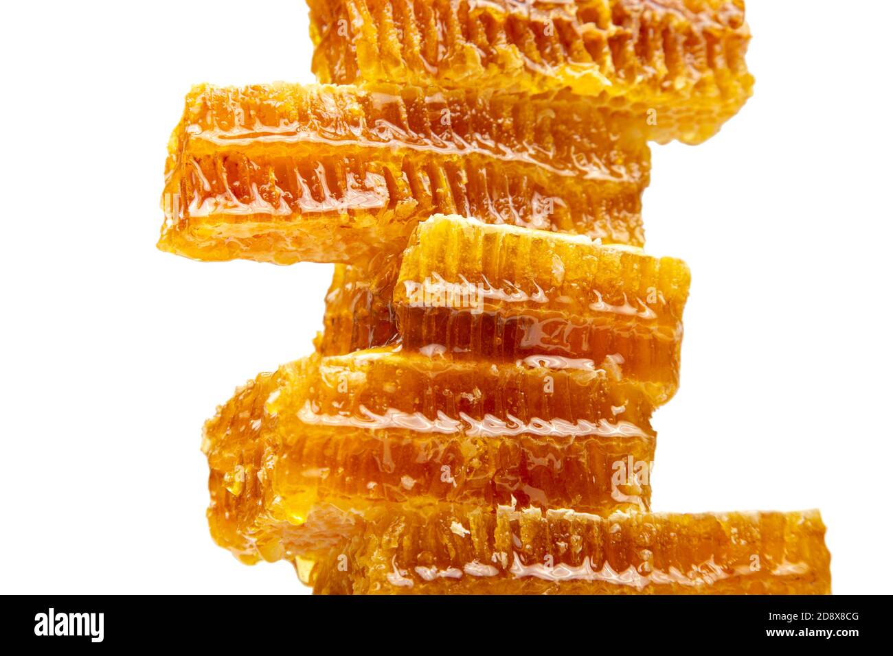 Pyramid of fresh bee comb honey on white background Stock Photo - Alamy