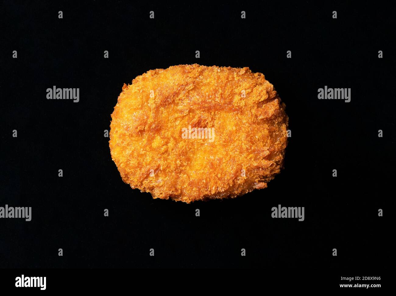 A croquette on a black background. A view from above Stock Photo - Alamy