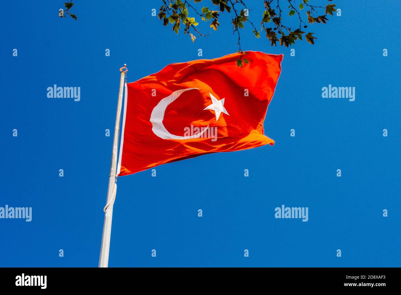 Turkish national flag with white star and moon on a pole in sky Stock ...