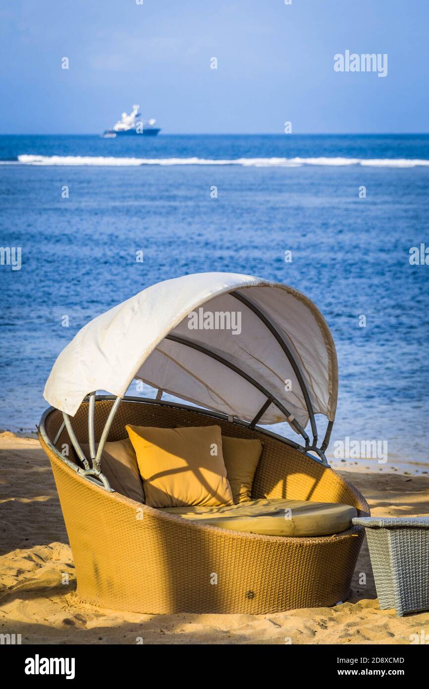 sheltered beach lounge chair with overhead cover on a topical beach by ...
