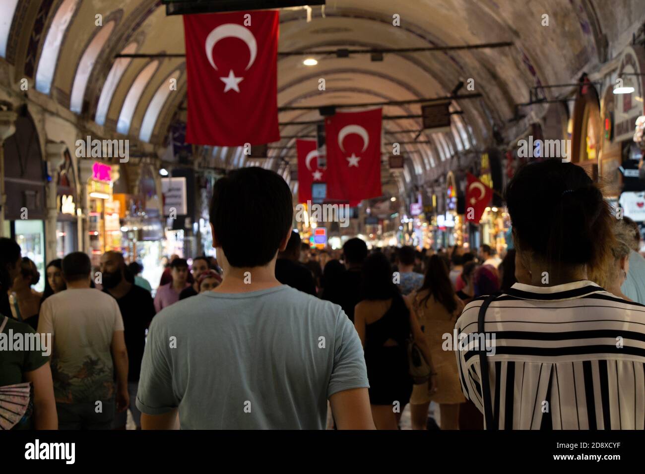 Interior view of the Grand Bazaar. Tourists shopping in the Grand ...