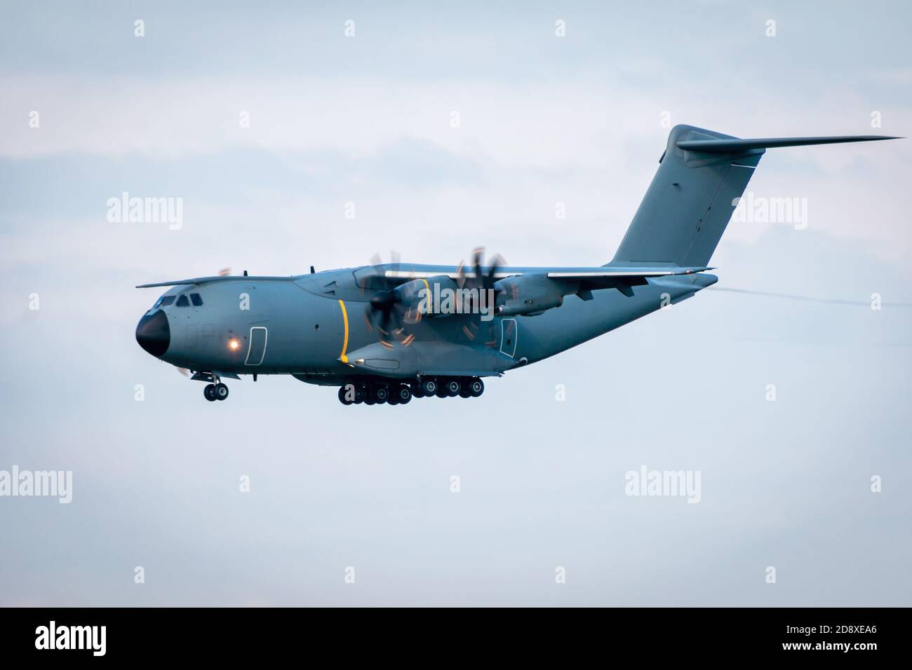 Landing heavy military transport turboprop aircraft Stock Photo - Alamy