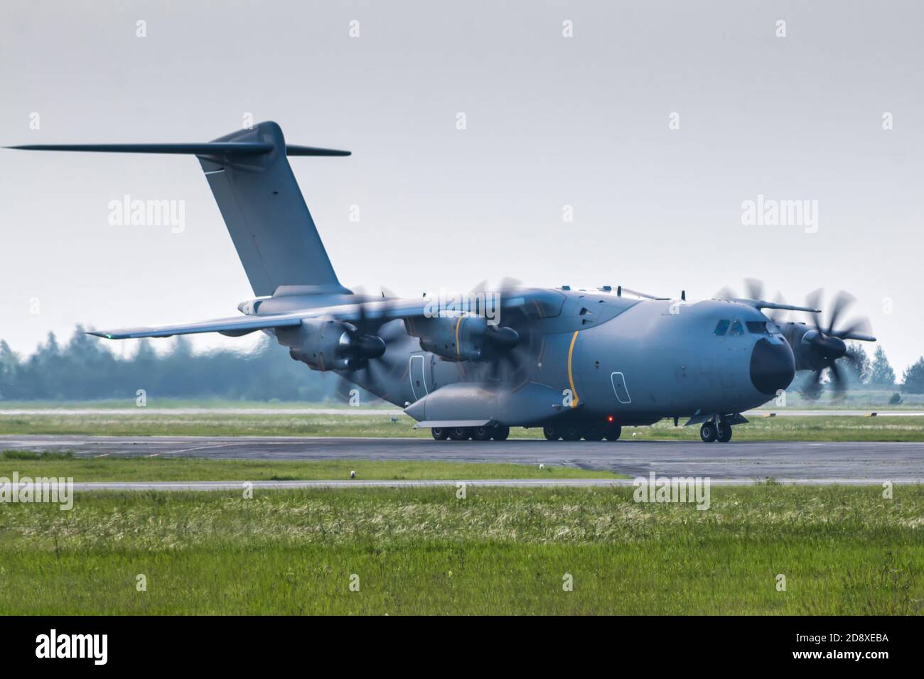Heavy military transport turboprop aircraft taxiing Stock Photo - Alamy