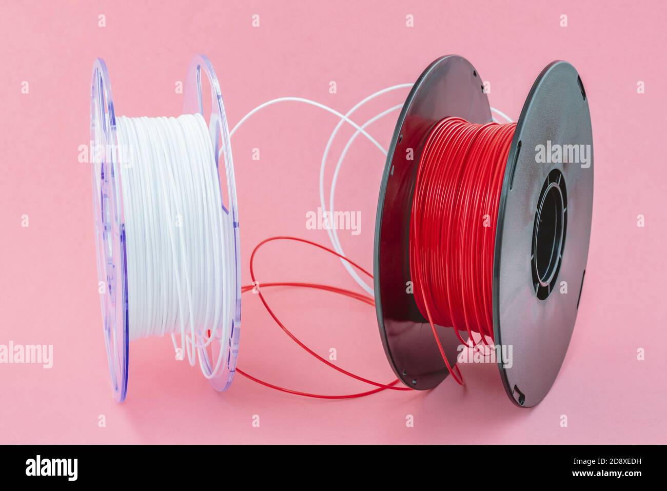 3D Printer Plastic Filament. Spool of white and red thermoplastic wire ...