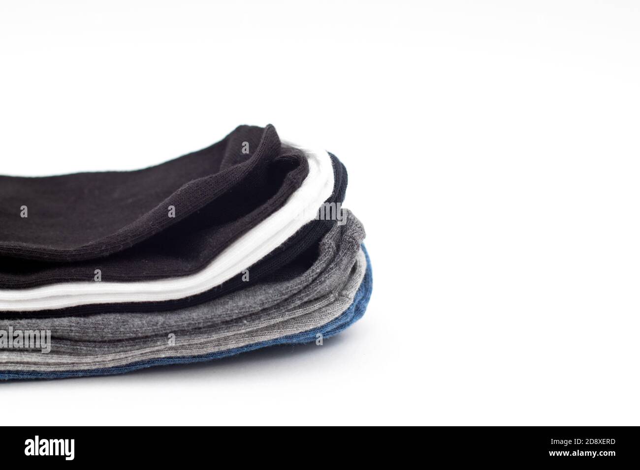 Packing a classic sock in different colors on a white background Stock ...