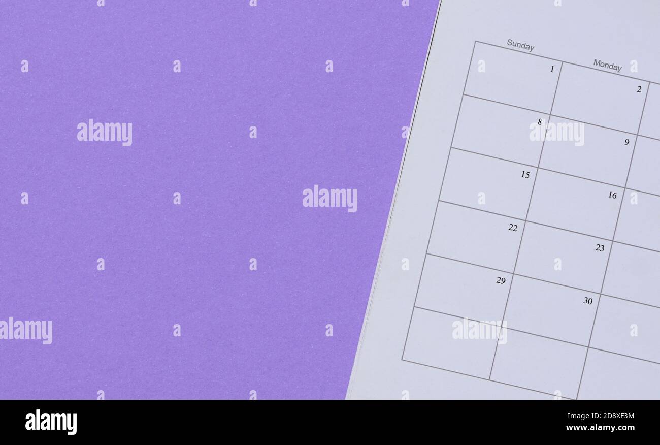 Calendar on purple background. Top view. Copy space Stock Photo - Alamy