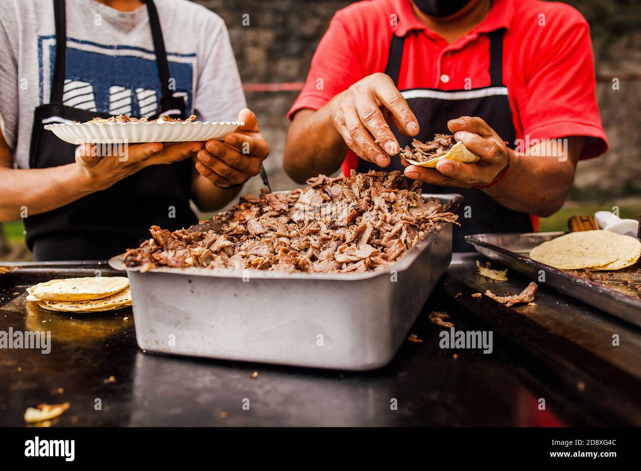 Mexican People eating tacos al pastor in Taqueria in Mexico Stock Photo ...