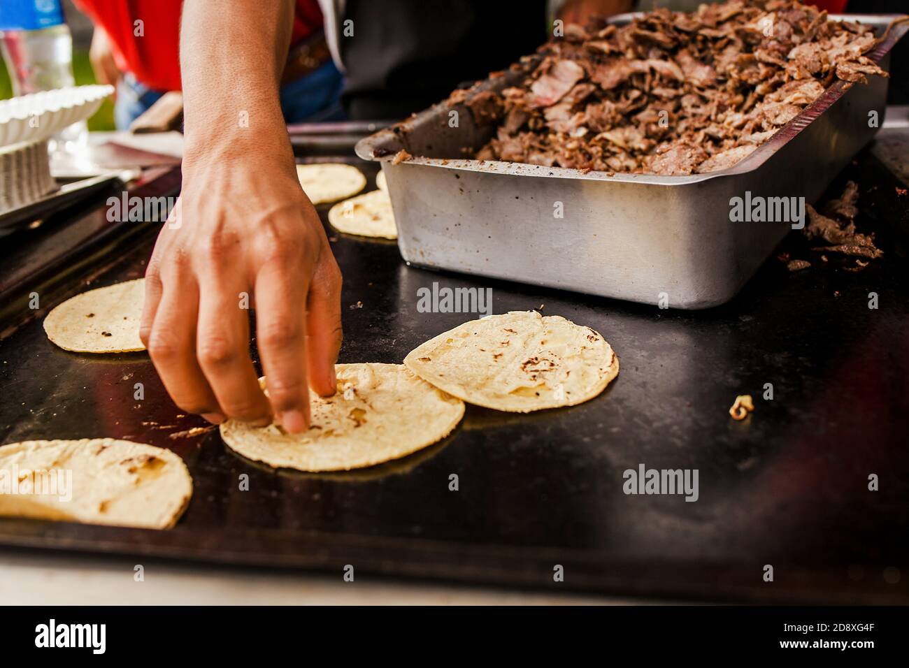 Mexican man making Tacos al Pastor in Mexico city Stock Photo - Alamy