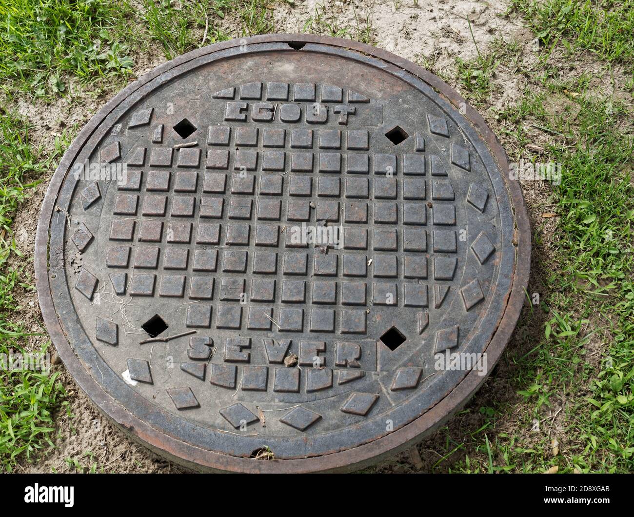 Metal manhole cover Stock Photo - Alamy