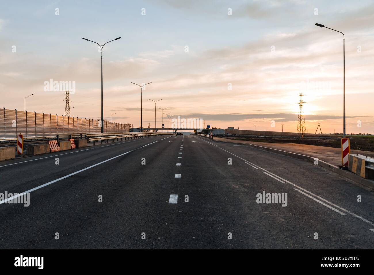 Newly built road with soundproof panels against the background of ...