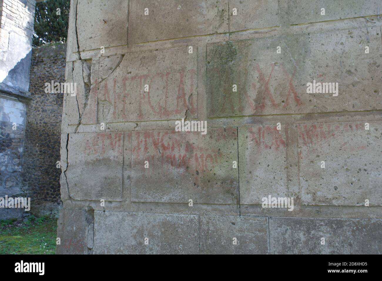 Ancient stone wall with faded red spray paint in Pompeii Italy Stock ...