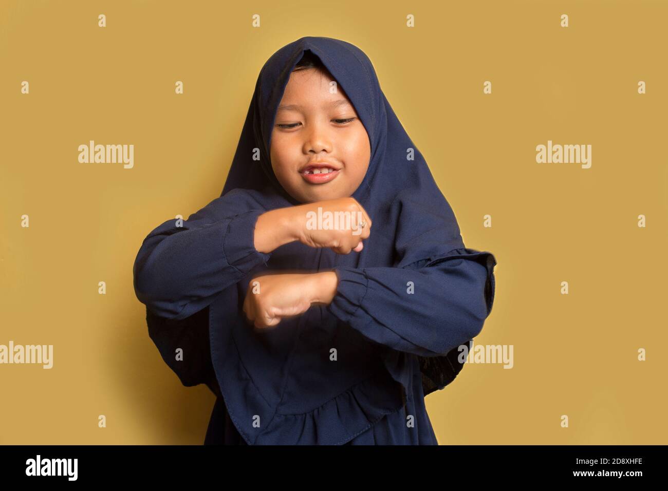 Happy little asian muslim hijab girl dancing Stock Photo - Alamy