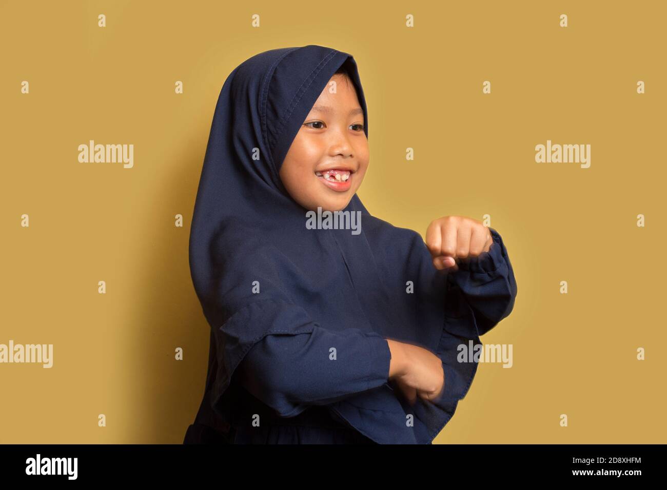 Happy little asian muslim hijab girl dancing Stock Photo - Alamy