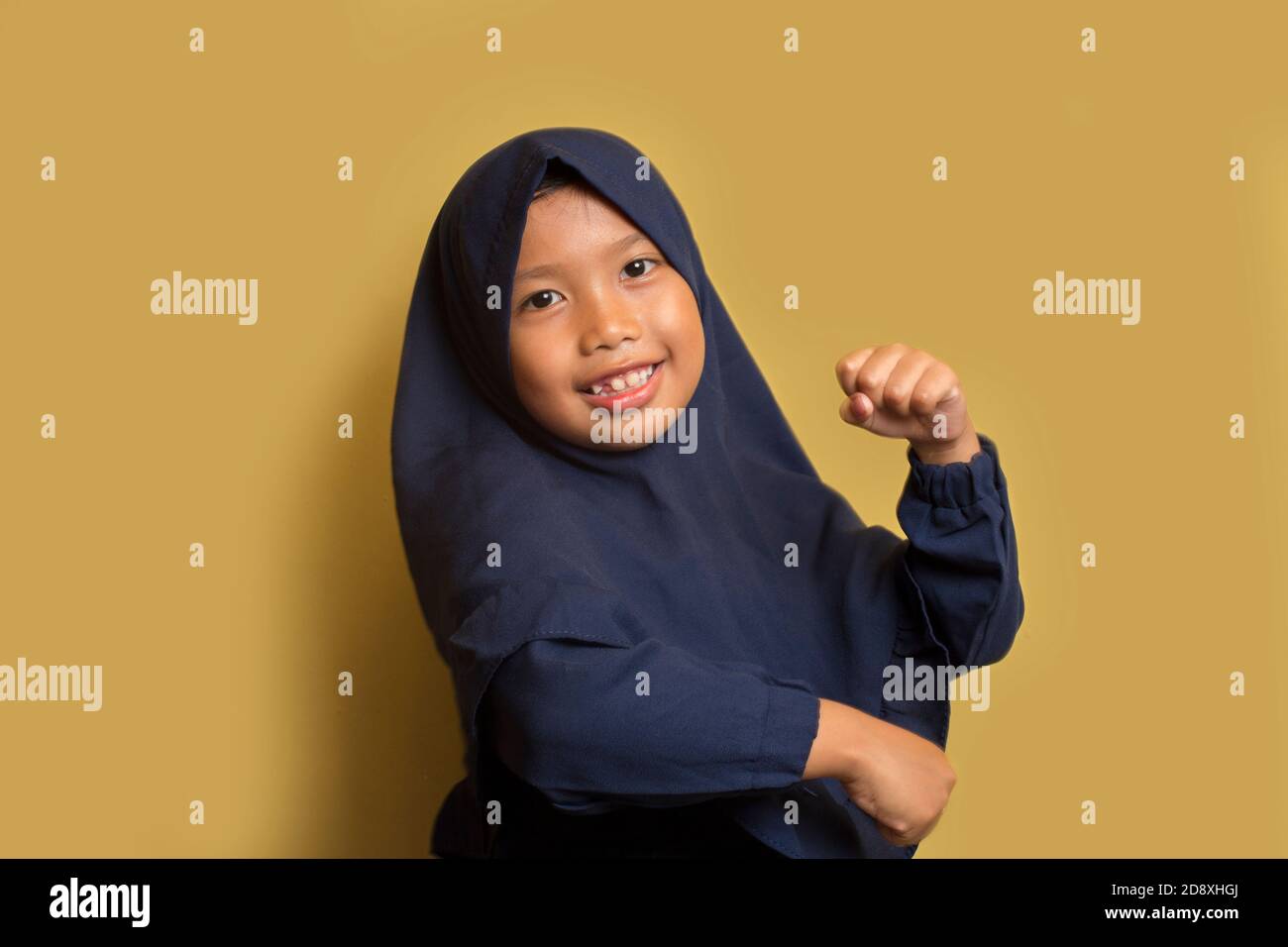 Happy little asian muslim hijab girl dancing Stock Photo - Alamy