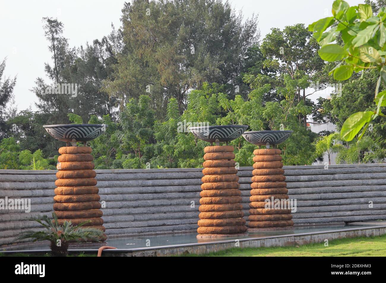 Stone wall, steps and planter. Colorful, landscaped garden with plant ...