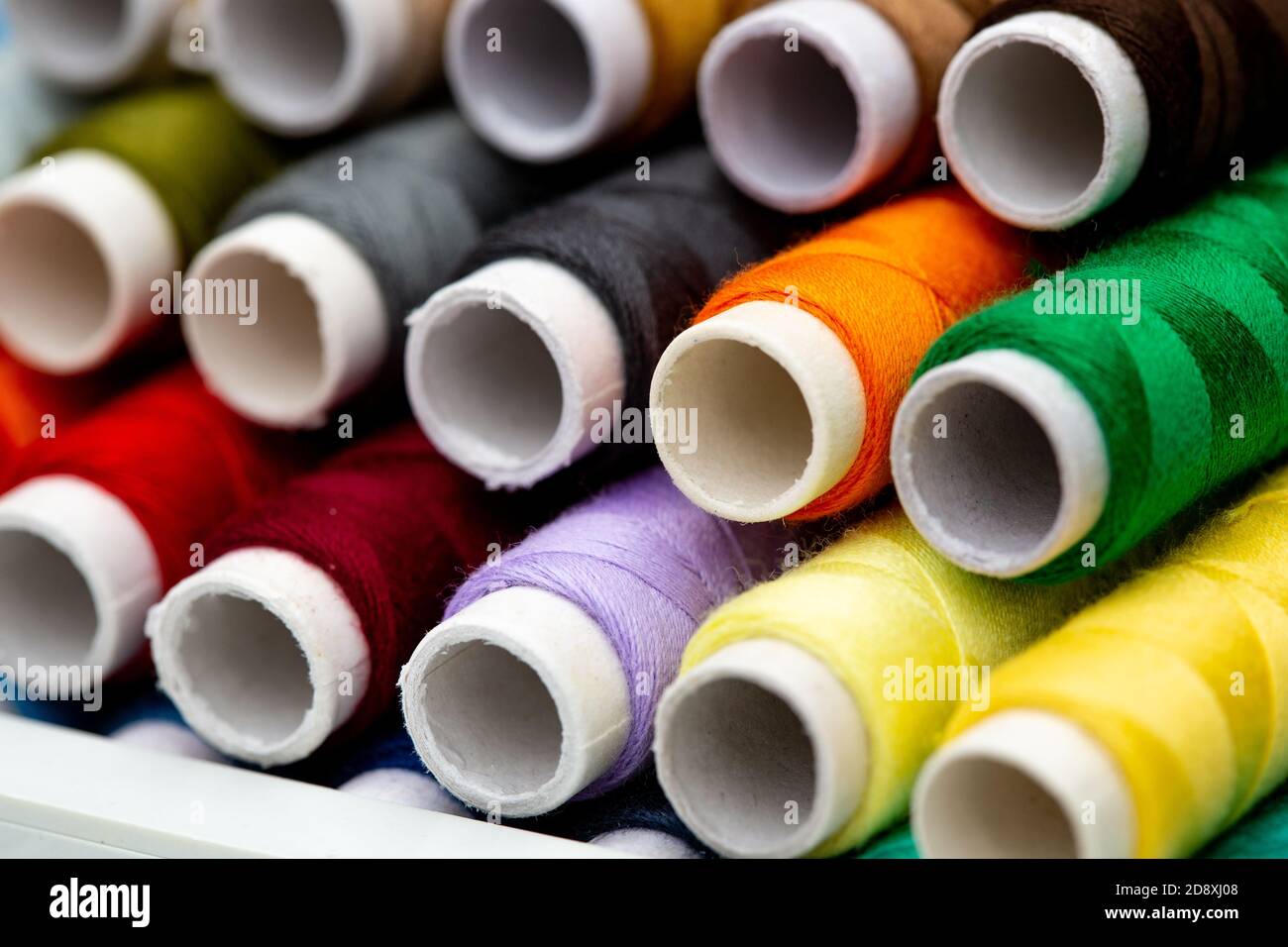 A set of threads in different colors. Multicolored threads for sewing ...