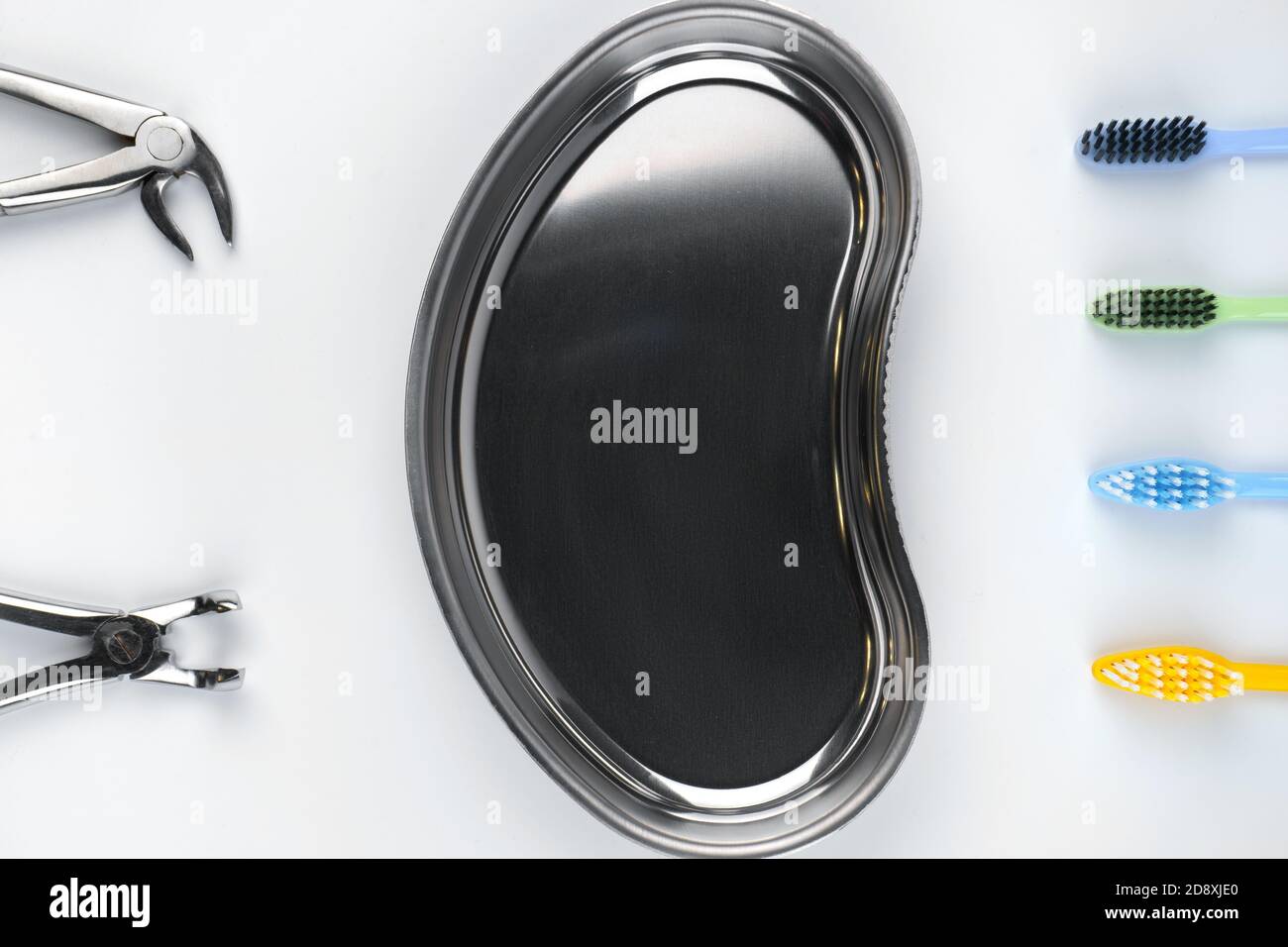 Image of kidney-shaped bowl with dental tools on white background Stock ...