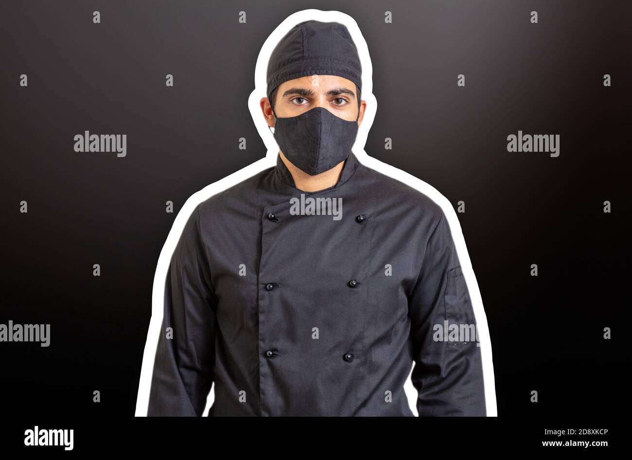 Chef in coronavirus days. Young cook with fabric face protection mask ...