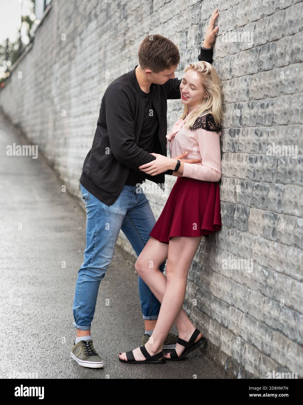 Hugging wall hi-res stock photography and images - Alamy