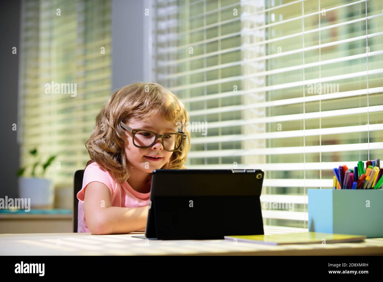 Back to school. Online remote learning. School kids with computer ...