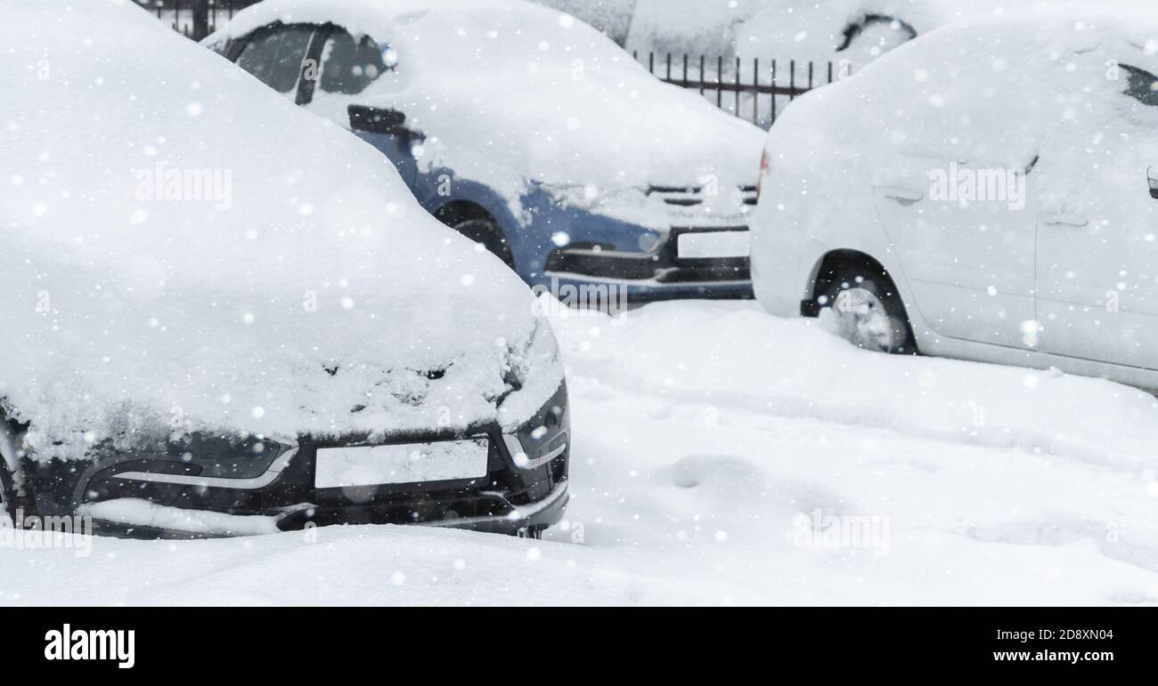 Parked cars covered with snow. Winter season Stock Photo - Alamy