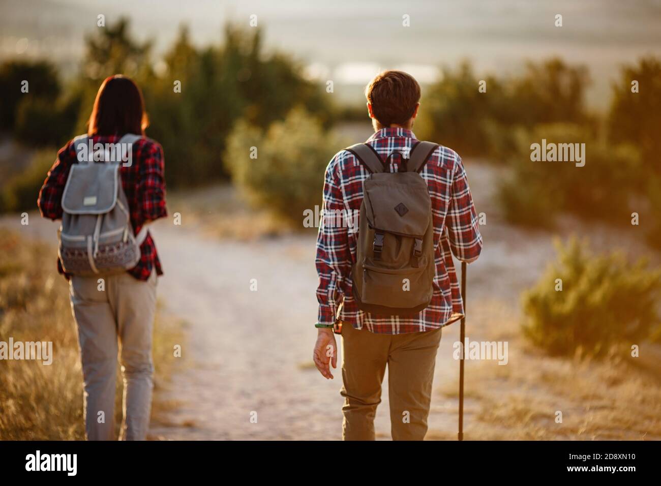 Portrait of happy young couple having fun on their hiking trip ...