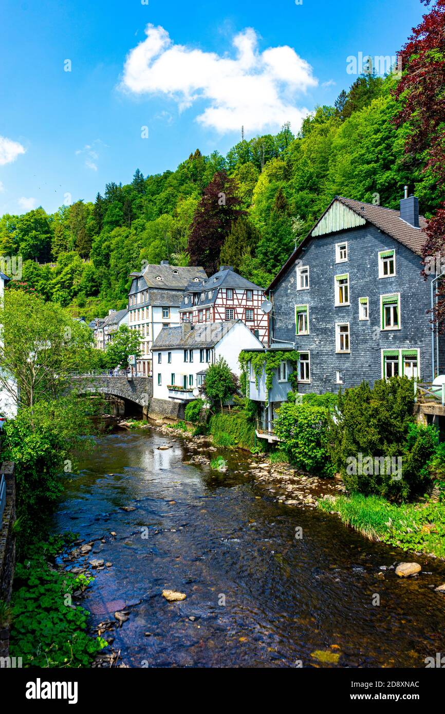 Houses along the Rur River in the historic center of Monschau, Germany ...
