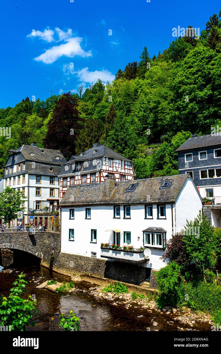 Houses along the Rur River in the historic center of Monschau, Germany ...