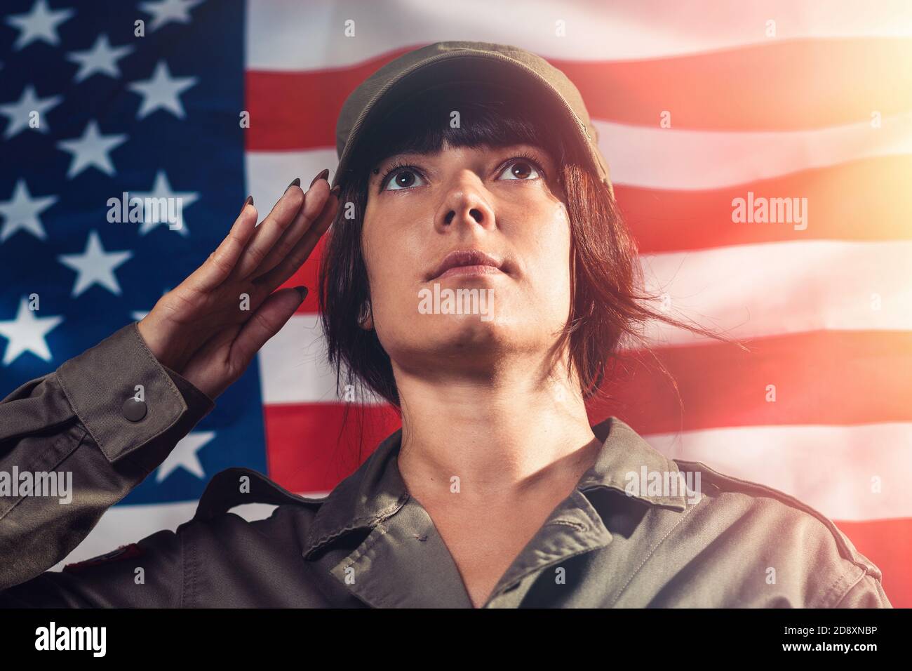 Woman saluting american flag hi-res stock photography and images - Alamy