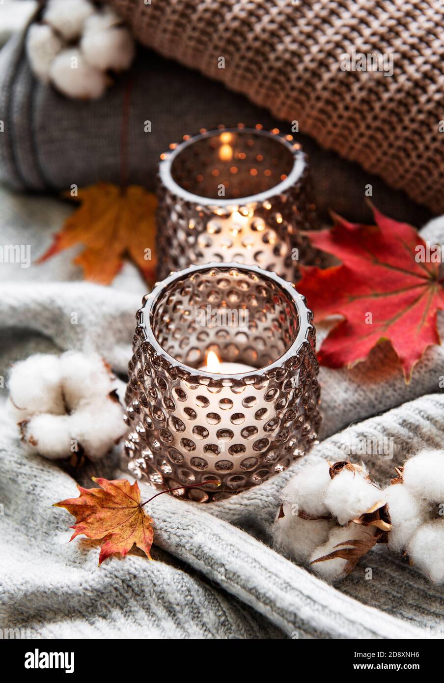 Cosy and soft autumn background, knitted sweaters and candles Stock ...