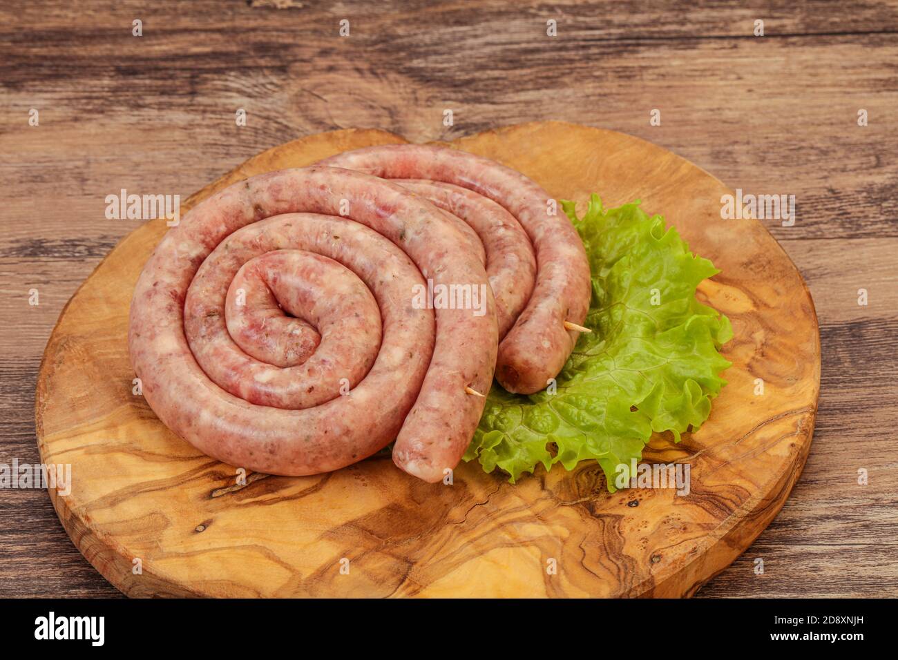 Raw pork sausage ring for grill Stock Photo - Alamy