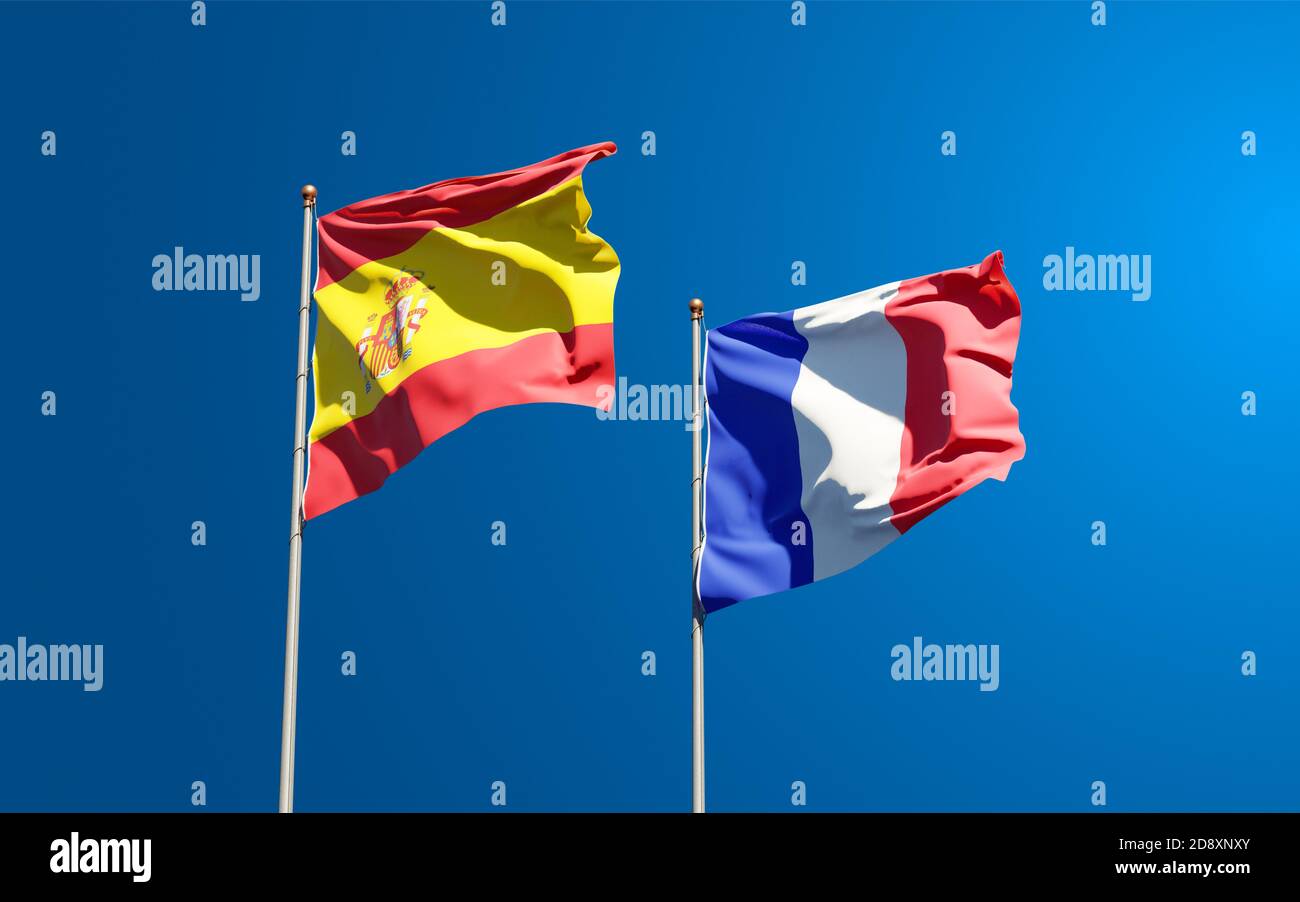 Beautiful national state flags of France and Spain together at the sky ...